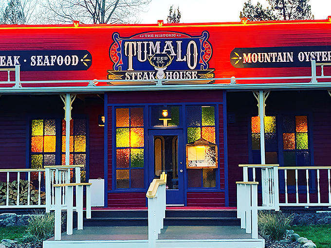 The iconic red exterior of Tumalo Feed Co. stands like a Western mirage against the Oregon sky, promising carnivorous delights within.
