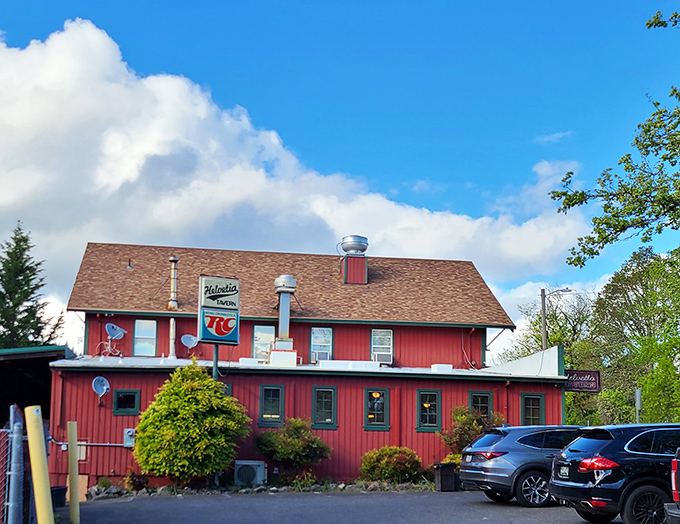 The red farmhouse-style building stands proudly against Oregon's blue sky, like a burger beacon calling hungry travelers home.