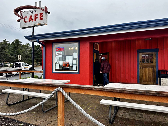 The iconic red exterior of Otis Cafe stands like a beacon of hope for hungry travelers along Highway 18, promising comfort food salvation just minutes from Lincoln City.