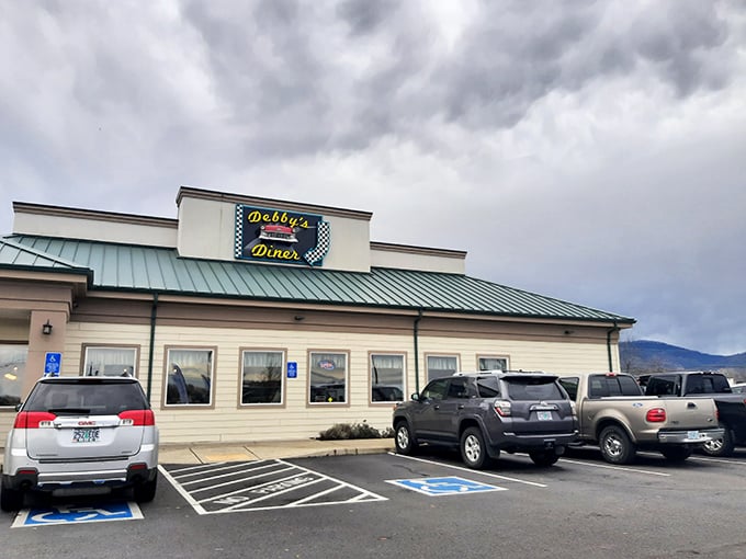 Debby's Diner stands proudly against Oregon's sky, its checkered sign promising a journey back to simpler times when calories weren't counted, just enjoyed.