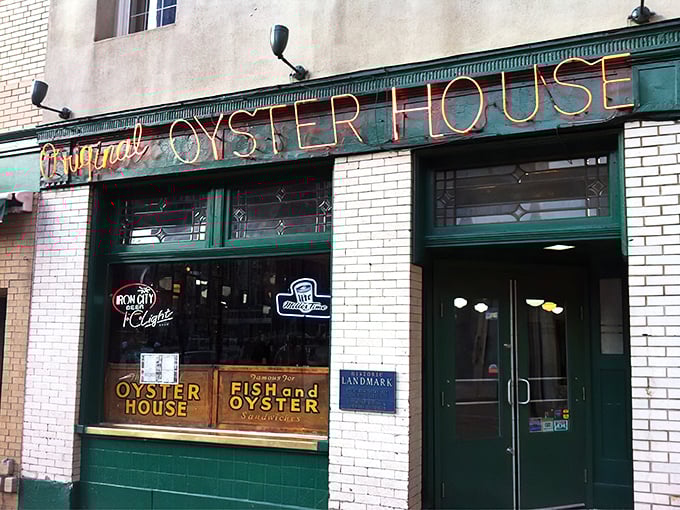 The neon glow of seafood salvation! Pittsburgh's Original Oyster House stands like a time capsule in Market Square, its red sign beckoning hungry souls since long before Instagram existed.