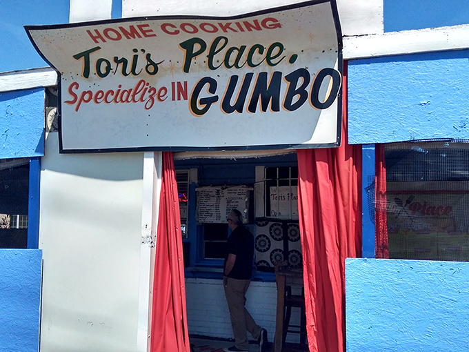 The unassuming blue exterior of Tori's Place stands like a culinary speakeasy – no fancy frills, just the promise of soul-satisfying greatness within.