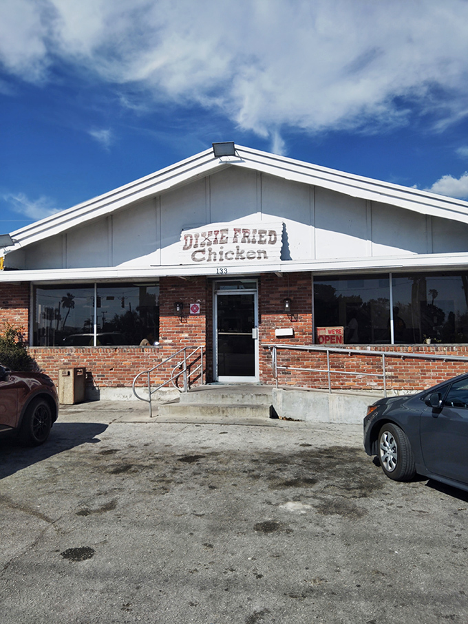 The unassuming brick exterior of Dixie Fried Chicken stands like a culinary lighthouse in Belle Glade, promising comfort food salvation to those in the know.
