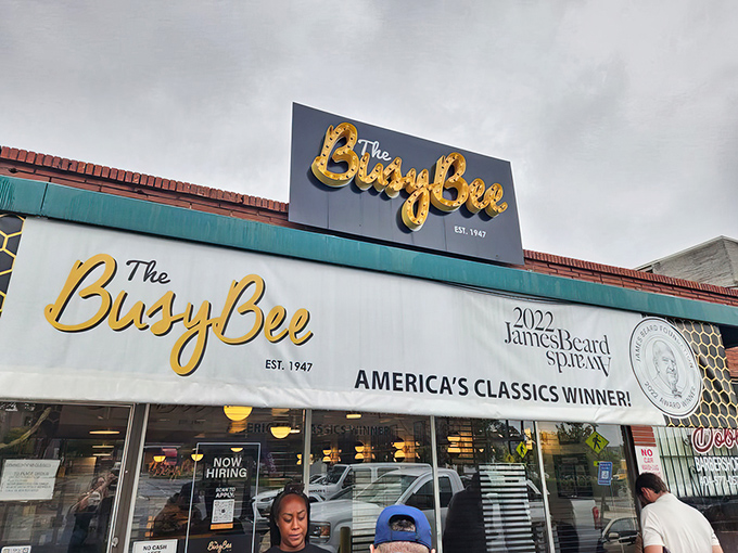 The iconic blue and yellow sign beckons hungry pilgrims like a Southern food lighthouse. The James Beard award banner confirms what locals already knew: this place is legendary.