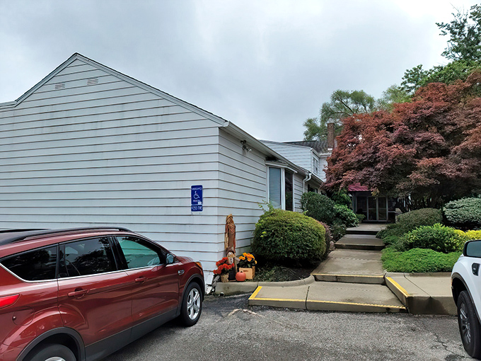 The iconic red awning of Belgrade Gardens welcomes hungry pilgrims like a beacon of fried chicken salvation in Barberton.