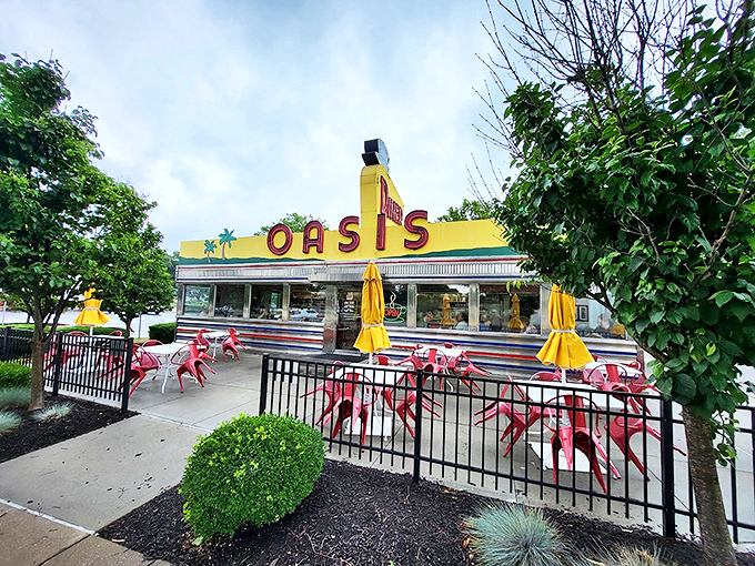 The classic stainless steel and stone exterior of The Oasis Diner stands like a time capsule on Plainfield's landscape, its iconic yellow sign beckoning hungry travelers.