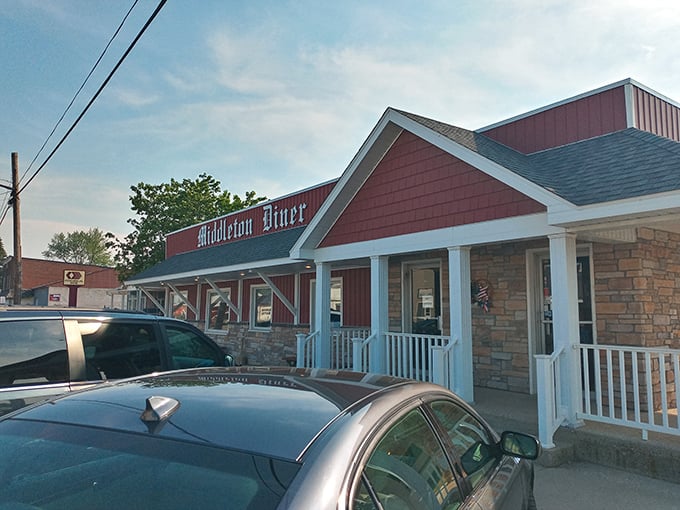 The classic red exterior of Middleton Diner stands like a beacon of comfort food promise against Michigan's ever-changing skies.
