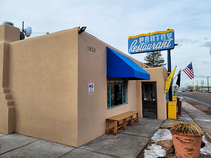 The neon glow of The Pantry's sign against the twilight sky is like a culinary lighthouse guiding hungry souls to shore.