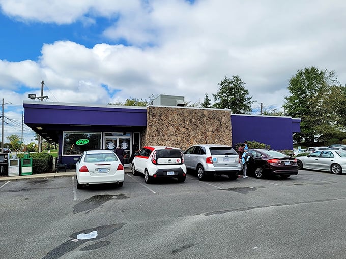 The purple exterior might surprise you, but that neon "OPEN" sign speaks a universal language that translates to "good food inside."