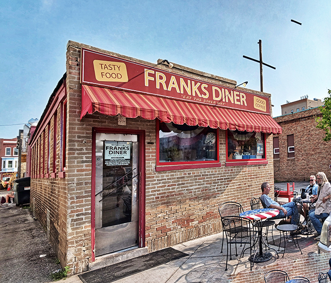Frank's iconic red awning beckons hungry travelers like a lighthouse for breakfast adventurers. "Tasty Food" isn't just signage&mdash;it's a sacred promise.
