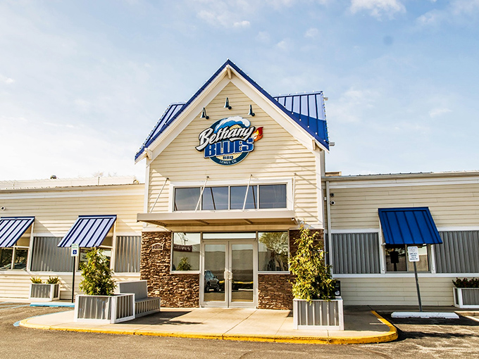 Bethany Blues' inviting exterior promises barbecue salvation with its distinctive blue roof and welcoming stone entrance&mdash;a coastal Delaware landmark that beckons hungry travelers.