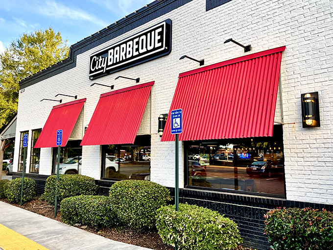 The rustic wooden beams and bright red doors of City Barbeque aren't just inviting—they're practically a smoke signal to your stomach saying "come hither."