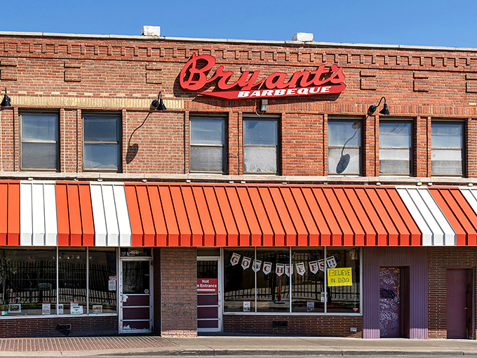 The iconic brick fortress of flavor stands proudly on the corner of 18th and Brooklyn, its red awnings like barbecue battle flags in Kansas City's culinary landscape. 