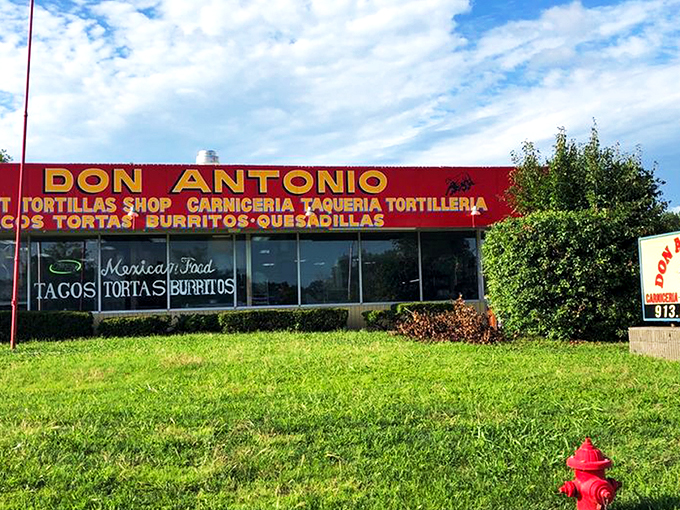 The bright red signage of Don Antonio stands out like a beacon of culinary promise against the Kansas sky, beckoning hungry travelers with its straightforward mission.