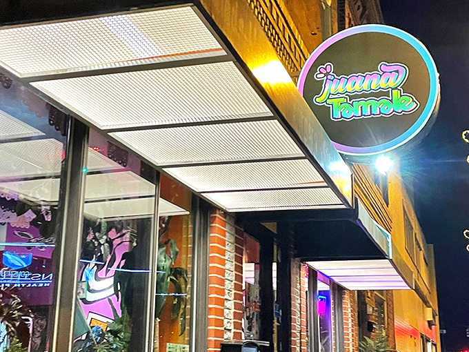 The colorful storefront of Juana Tamale beckons like a fiesta waiting to happen. Mexican flags and vibrant signage promise authentic flavors on East Passyunk Avenue.