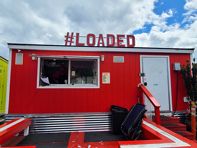 The fire-engine red food cart stands like a beacon of culinary promise, drawing hungry pilgrims from across Oregon to its flavorful sanctuary.