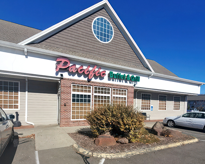 The red and green neon sign of Pacific Buffet & Grill beckons like a lighthouse for the hungry traveler navigating suburban Connecticut.