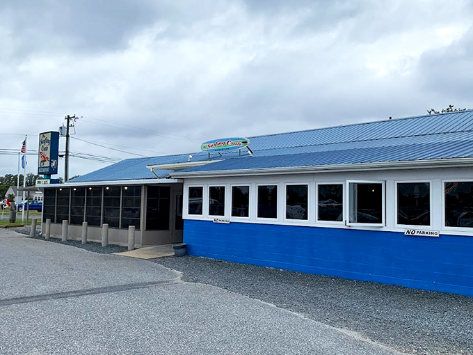 The blue-sided sanctuary of seafood salvation sits unassumingly along the highway, promising treasures from the deep for those wise enough to stop.