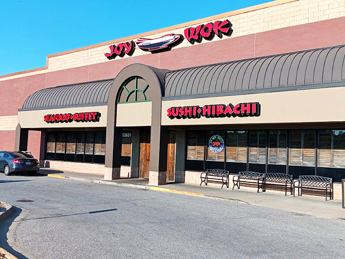 The bright red signage of JOY WOK beckons like a culinary lighthouse, promising a harbor of flavors that'll make your taste buds throw a parade.