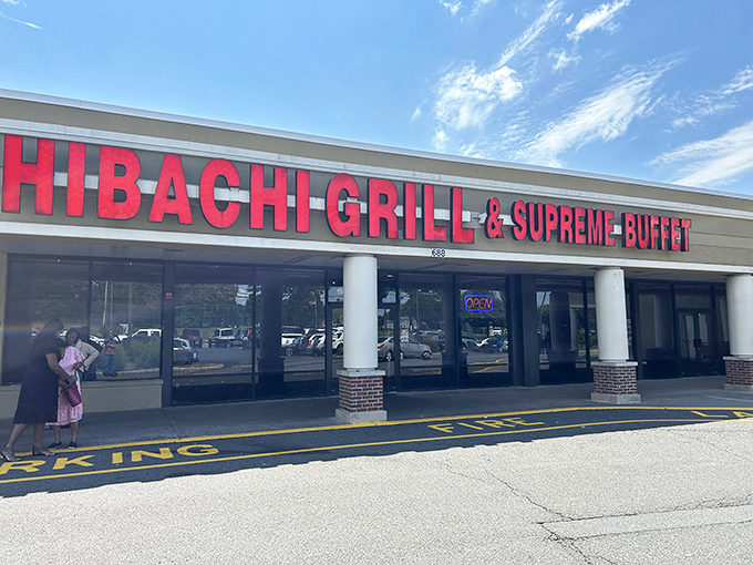 The bright red signage acts like a beacon for hungry souls. Simple storefront, extraordinary promises of culinary abundance within.