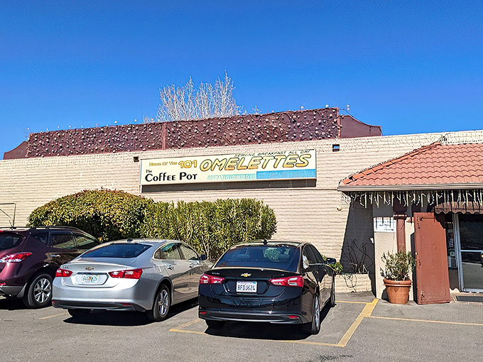 The red-roofed sanctuary of breakfast dreams stands proudly against Sedona's iconic red rocks, promising morning salvation for hungry travelers.