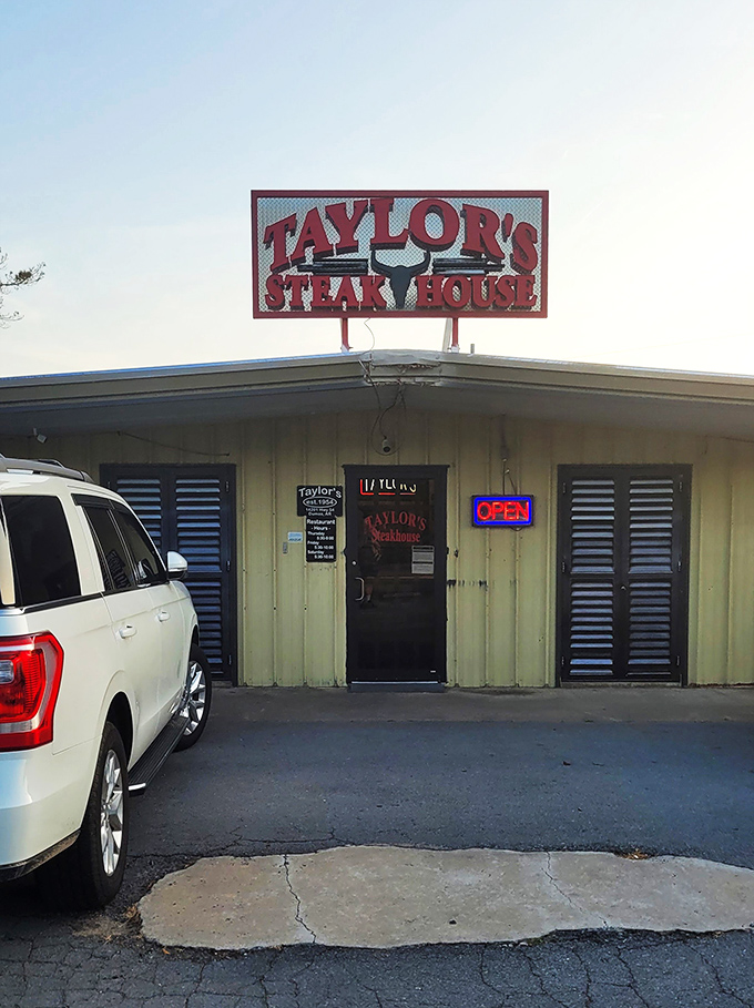 The unassuming yellow exterior of Taylor's Steakhouse stands as proof that culinary greatness often hides in plain sight.
