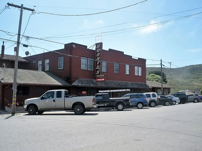 The iconic rose-colored exterior of Duarte's Tavern stands like a culinary lighthouse on Pescadero's main drag, beckoning hungry travelers since 1894.