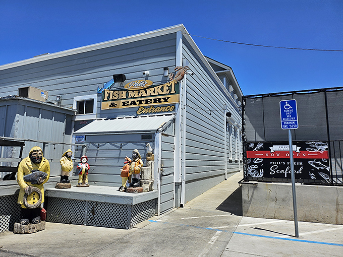 The unassuming exterior of Phil's Fish Market stands beneath Castroville's iconic sign, proving that culinary treasures often hide in plain sight.
