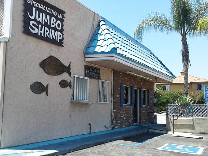 The turquoise roof of Shrimp House stands out like a maritime beacon in suburban Arcadia, promising seafood treasures within its humble brick walls.