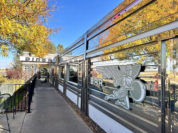 The classic silver exterior of Moonlight Diner gleams in the Colorado sunshine, a chrome time capsule promising comfort food and nostalgia just steps from Denver International Airport.