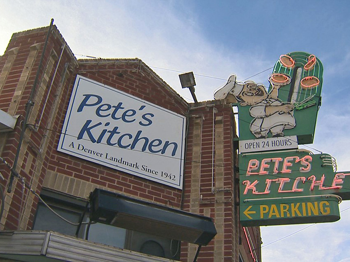 That iconic neon sign beckons like an old friend, promising comfort food and conversations that matter on Denver's storied Colfax Avenue.