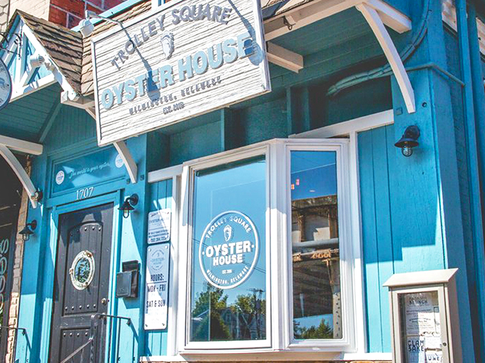 The blue facade of Trolley Square Oyster House beckons like a coastal lighthouse in urban Wilmington. Nautical charm meets historic neighborhood vibes.