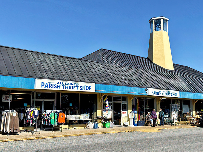 The iconic yellow bell tower of All Saints' Parish Thrift Shop stands like a lighthouse, guiding bargain hunters to this treasure-filled haven on Coastal Highway.