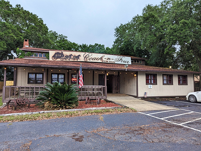 The unassuming exterior of Coach-n-Four Steakhouse stands as a time capsule of old Florida dining, where steak legends are born beneath towering pines.