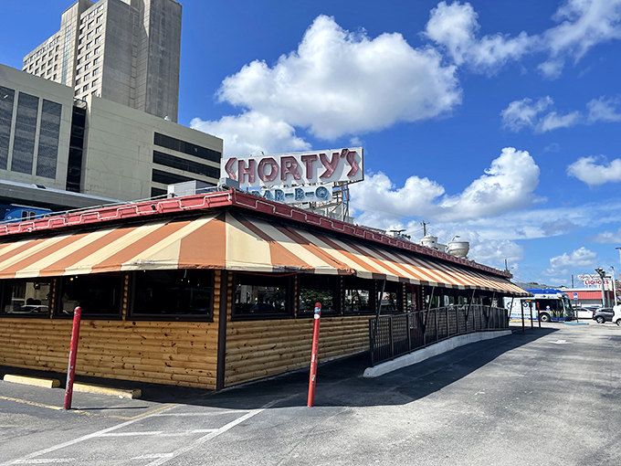 The iconic red and white striped awning of Shorty's has been Miami's smoke signal to barbecue lovers since 1951. A landmark that's survived hurricanes, fires, and food trends.