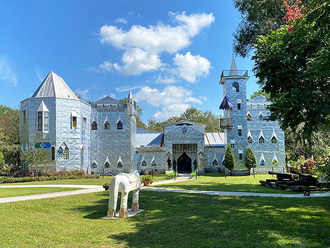 The shimmering facade of Solomon's Castle catches Florida sunlight like a medieval disco ball, complete with vibrant pink flowers that seem to bow in admiration.
