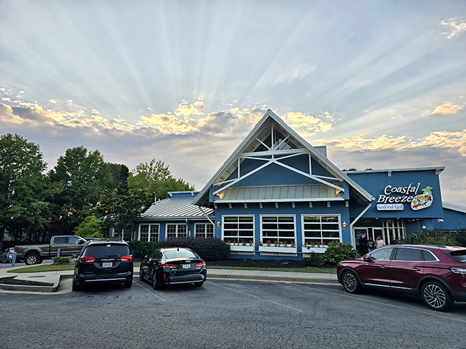 The bright blue exterior of Coastal Breeze stands out like a maritime mirage in landlocked Buford, promising seafood treasures within.