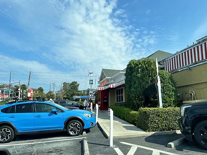 The iconic red and white awning of OK Cafe stands as a beacon of Southern comfort food in Atlanta's West Paces Ferry area.