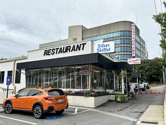 The iconic white brick exterior of Silver Skillet stands like a time capsule in Midtown Atlanta, promising comfort food that transcends trends.