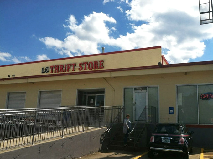 The unassuming exterior of Last Chance Thrift Store hides a universe of treasures within, like finding the Batcave behind Wayne Manor.