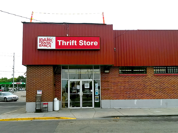 The iconic red exterior of Idaho Youth Ranch Thrift Store stands as a beacon of bargain-hunting possibilities in Meridian.