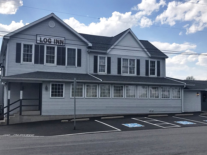 The weathered wooden sign and charming staircase welcome you to Indiana's oldest restaurant&mdash;no neon required when history speaks this loudly.