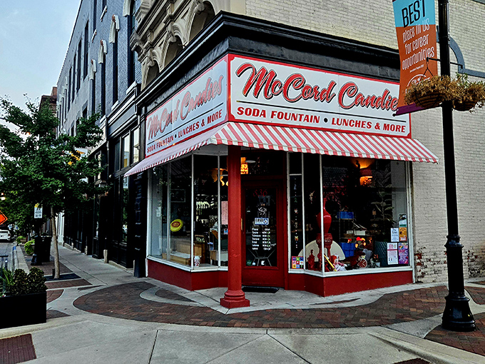 The iconic red and white striped awning of McCord Candies stands like a beacon of sweetness on Lafayette's Main Street, inviting passersby into a world of nostalgic treats.