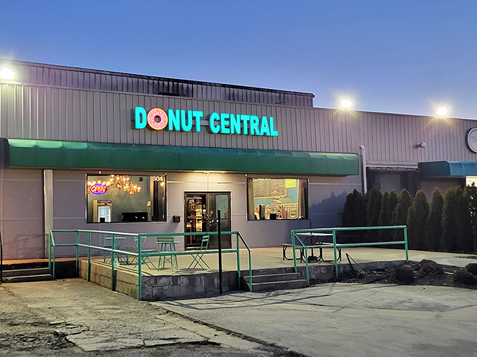 The teal and pink sign beckons like a sugar-coated lighthouse on the Columbus horizon. Donut Central's exterior promises sweet adventures within.