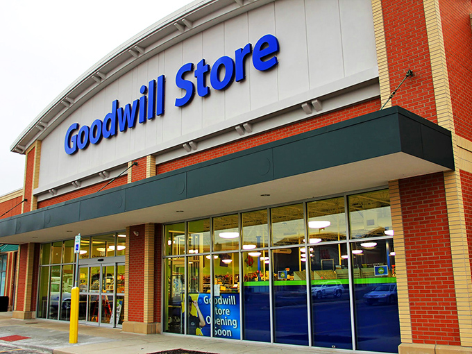 The Goodwill Store in Fishers stands like a fortress of forgotten treasures, its blue sign beckoning bargain hunters and nostalgia seekers alike.