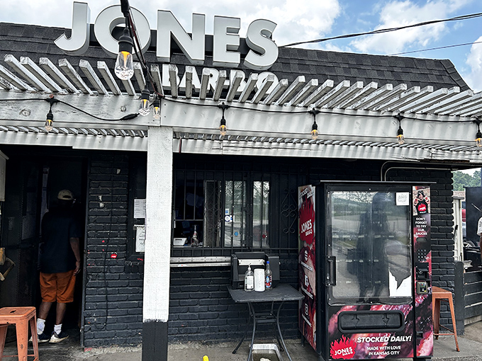 The unassuming black exterior of Jones Bar-B-Q speaks volumes: great barbecue doesn't need fancy digs, just smoke, skill, and soul. 