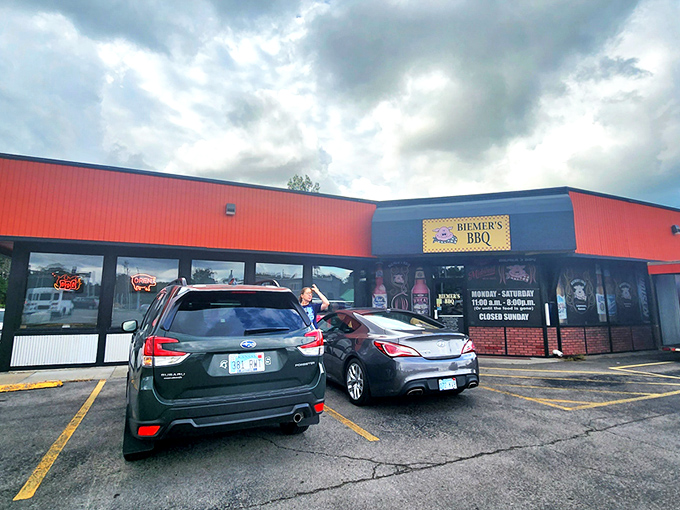 The bright red exterior of Biemer's BBQ stands like a beacon of hope for hungry travelers. This unassuming building houses smoky treasures that draw pilgrims from across Kansas.
