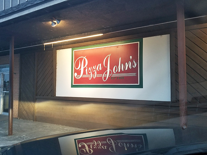 The unassuming exterior of Pizza John's in Derby might not stop traffic, but locals know this modest storefront houses pizza greatness.