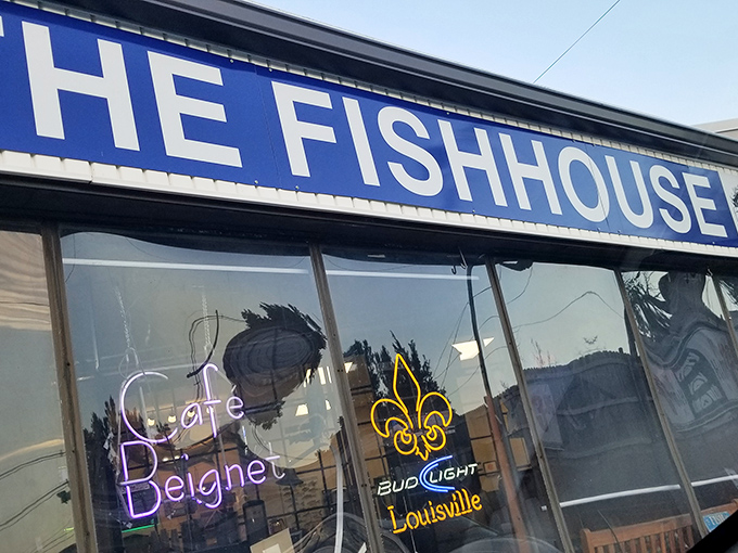 The unassuming exterior of The Fish House belies the seafood treasures within. Blue signage and simple storefront&mdash;culinary magic happens here. 