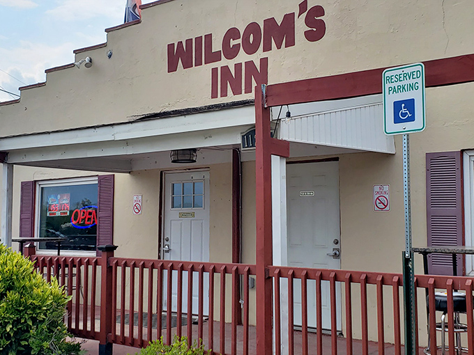 The unassuming exterior of Wilcom's Inn stands as a culinary speakeasy&mdash;proof that the best flavors often hide behind the simplest facades.